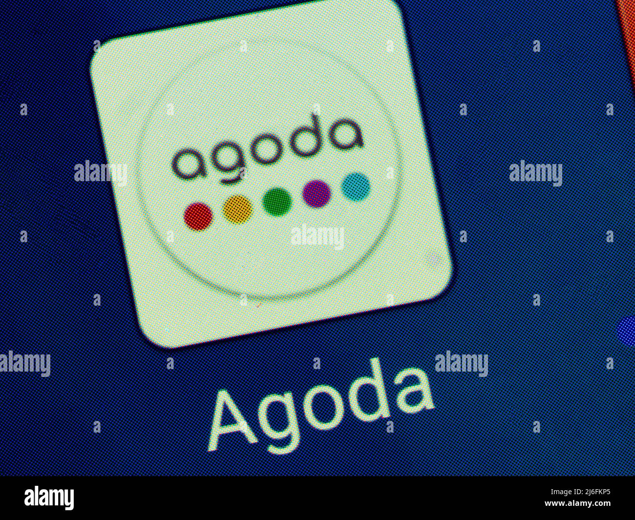 In this photo illustration, the Agoda logo is displayed on a smartphone ...