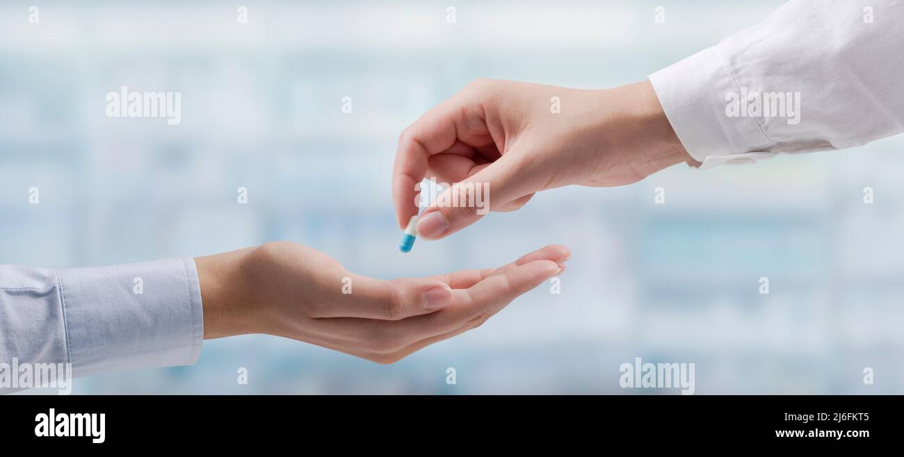 Professional doctor giving a prescription medicine to a patient Stock ...
