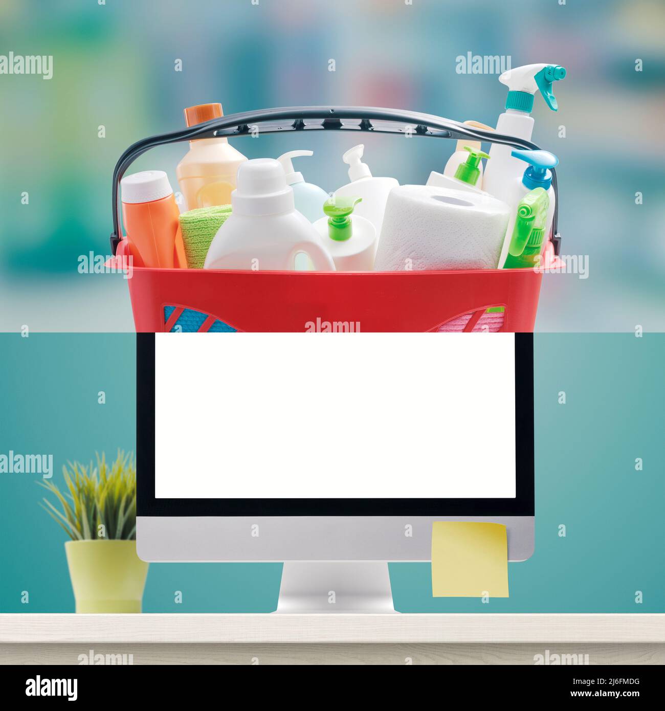 Shopping basket full of detergents and computer: online shopping ...