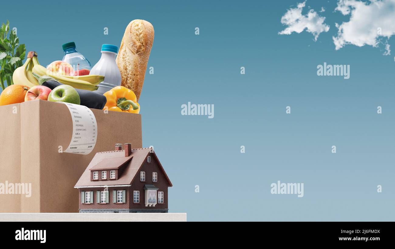 Grocery home delivery service: box with fresh goods, receipt and ...