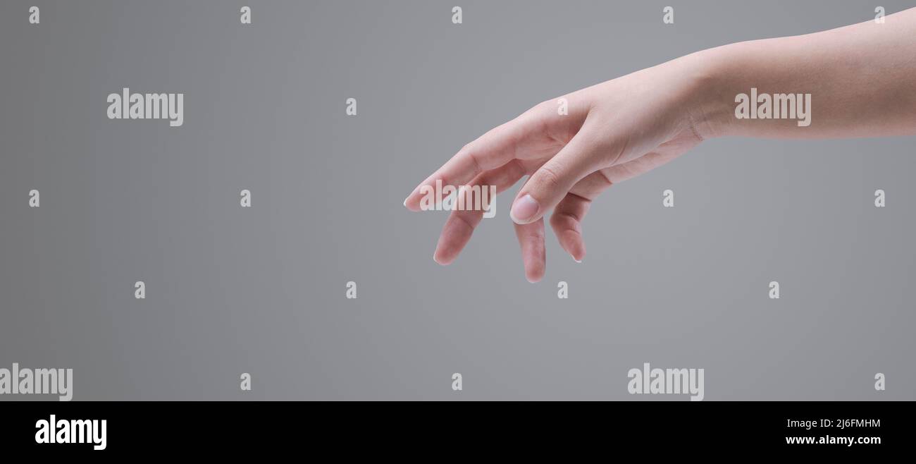 Hand picking something up hi-res stock photography and images - Alamy