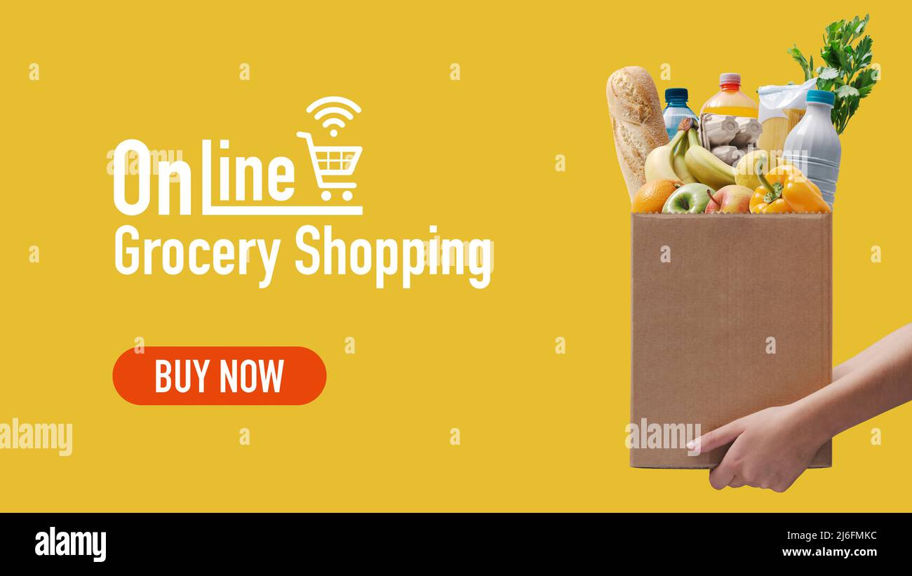 Online grocery shopping and home delivery: hands holding a box full of ...