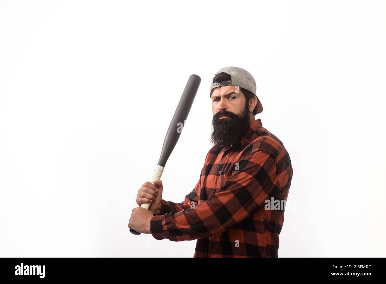 Professional baseball player. Bearded man in plaid shirt swing with bat ...