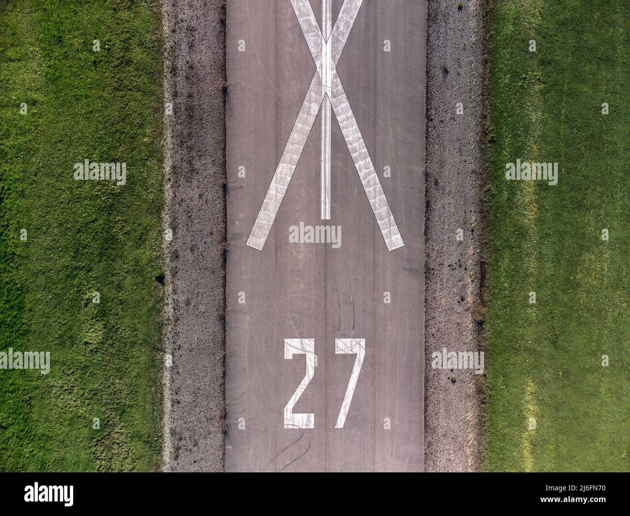 Flat view of a runway with the number 27 marked Stock Photo - Alamy