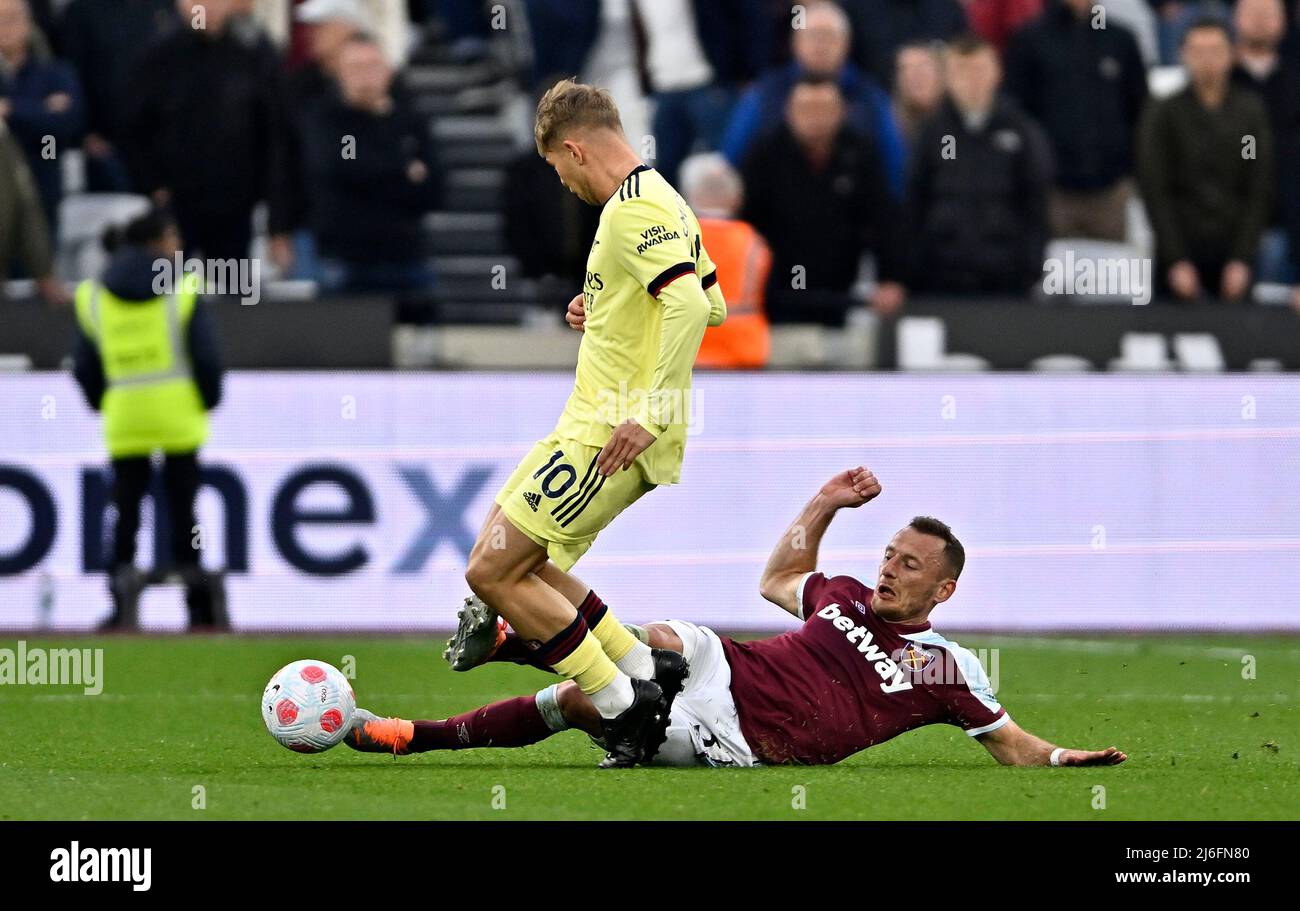 London UK 1st May 2022. Emile Smith Rowe (Arsenal) is tackled by ...
