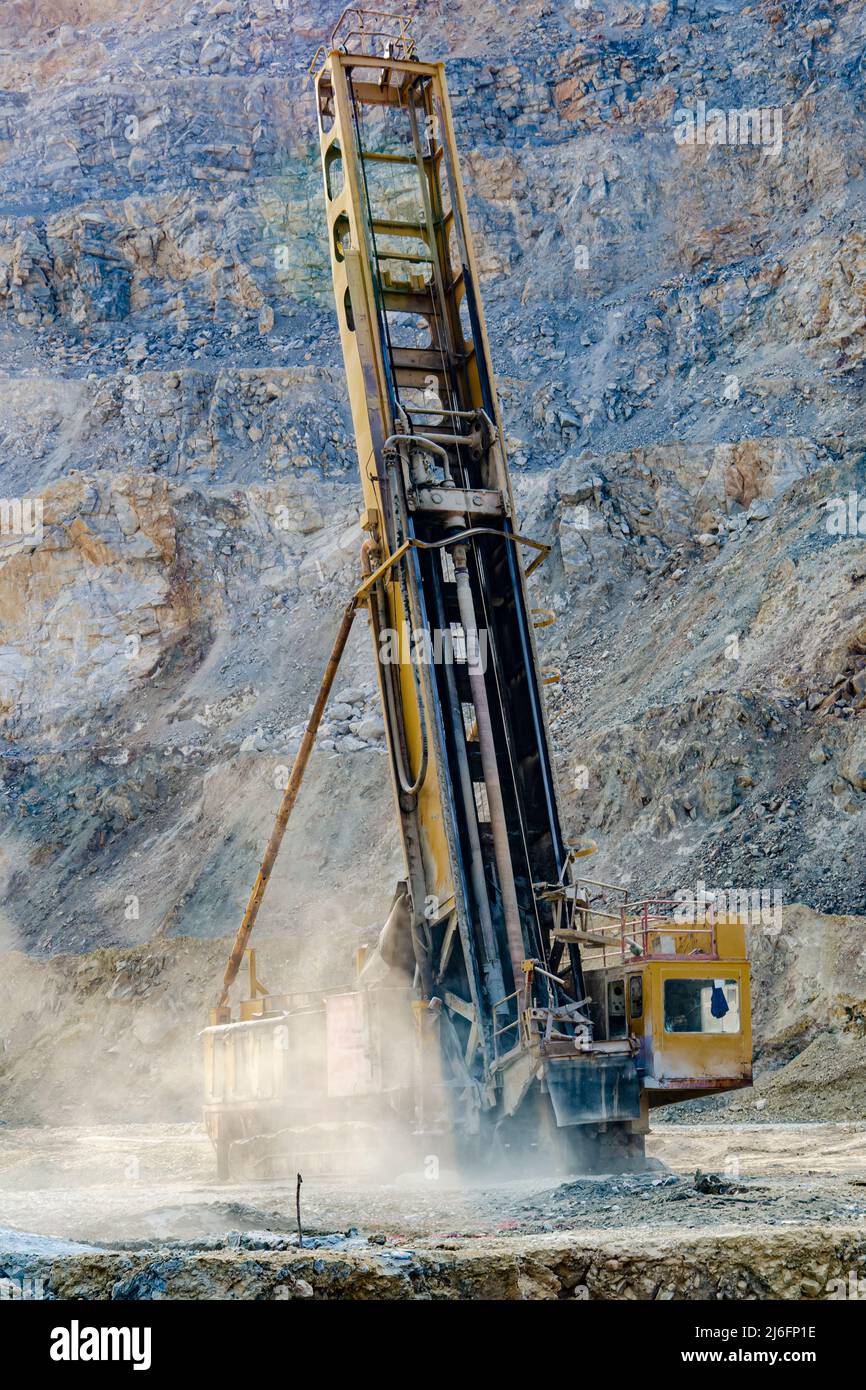 View at drilling rig in open pit mine Stock Photo - Alamy
