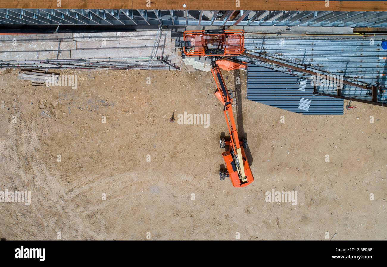 lift working at a construction site Stock Photo - Alamy
