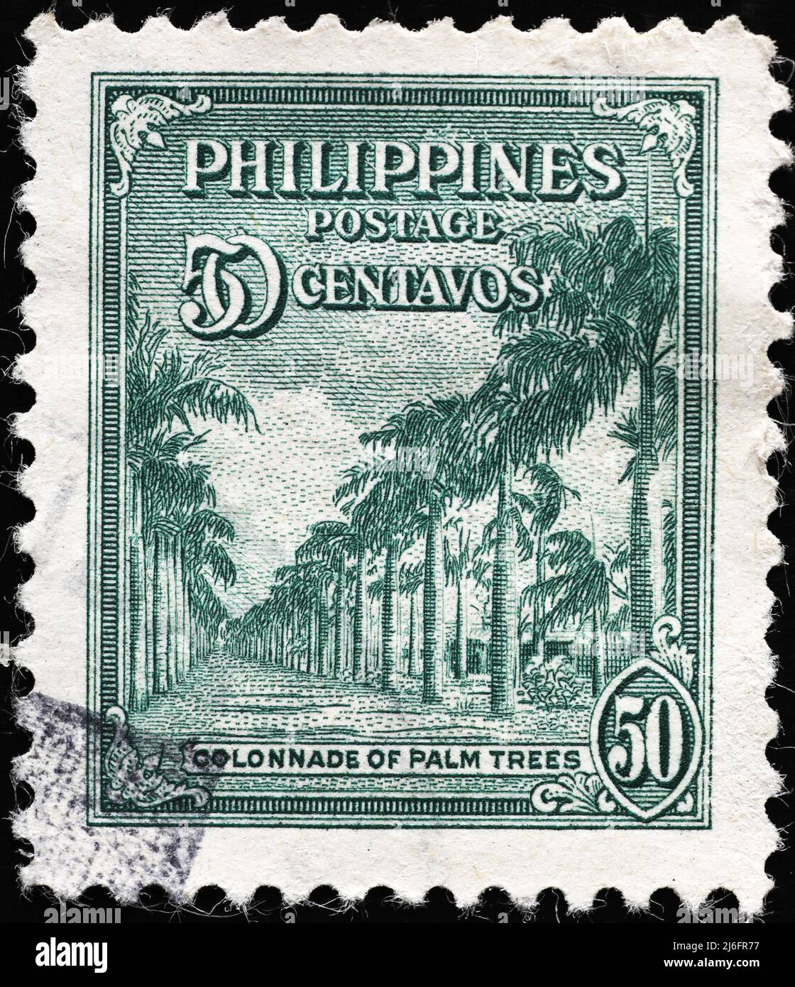 Tropical palm trees on vintage stamp of Philippines Stock Photo - Alamy