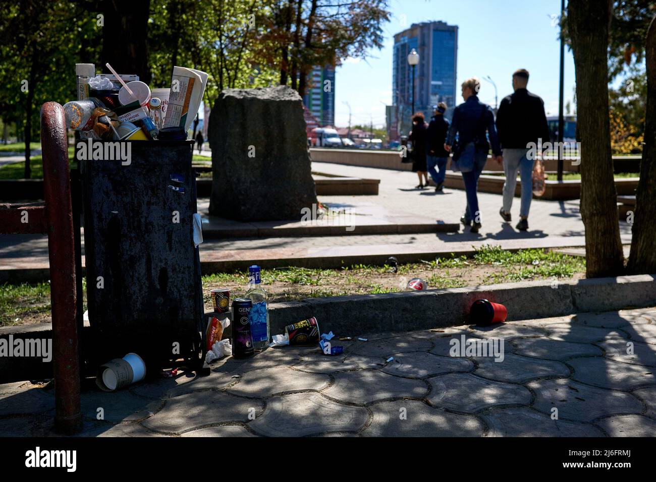 Overflowing trash cans on the city street on the international day of ...
