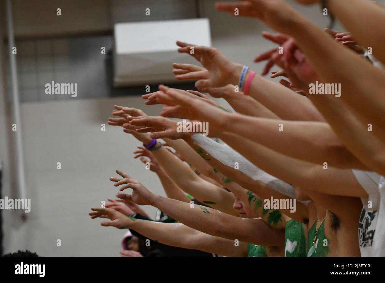 Fans wave fingers during foul shot in Basketball game Stock Photo - Alamy