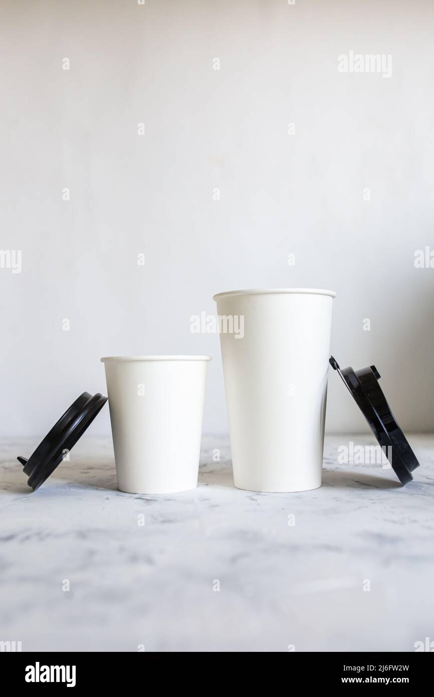 open cardboard coffee cups with lids. photos of disposable tableware ...