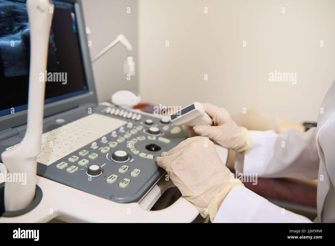 Focus on a radiologist hands in sterile protective surgical gloves ...