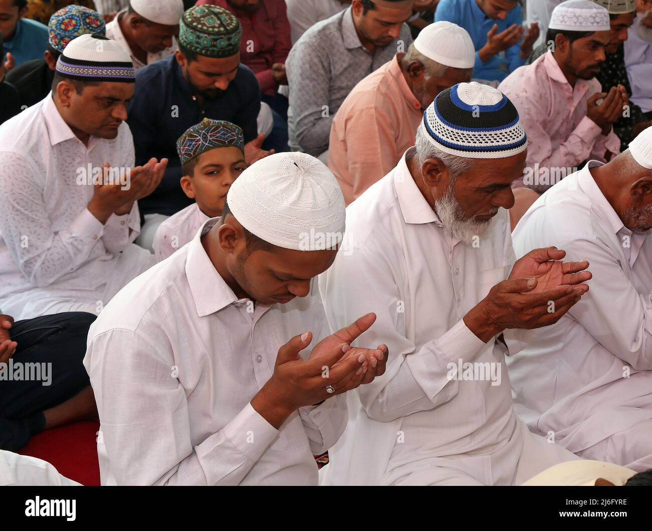 Muslim devotees offer prayers on the last Friday of the holy month of ...