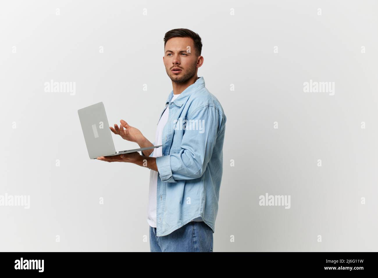 Confused irritated tanned handsome man in casual basic t-shirt shocked ...