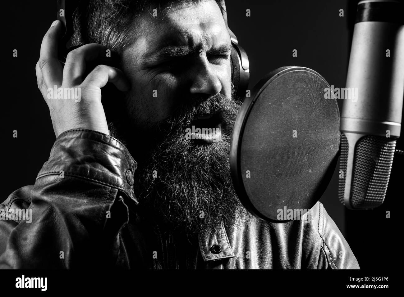 Singing man in a recording studio. Expressive face closeup Stock Photo ...