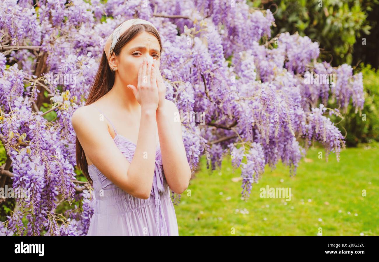 Spring allergy. Girl with nose sneezing. Allergic symptom concept ...