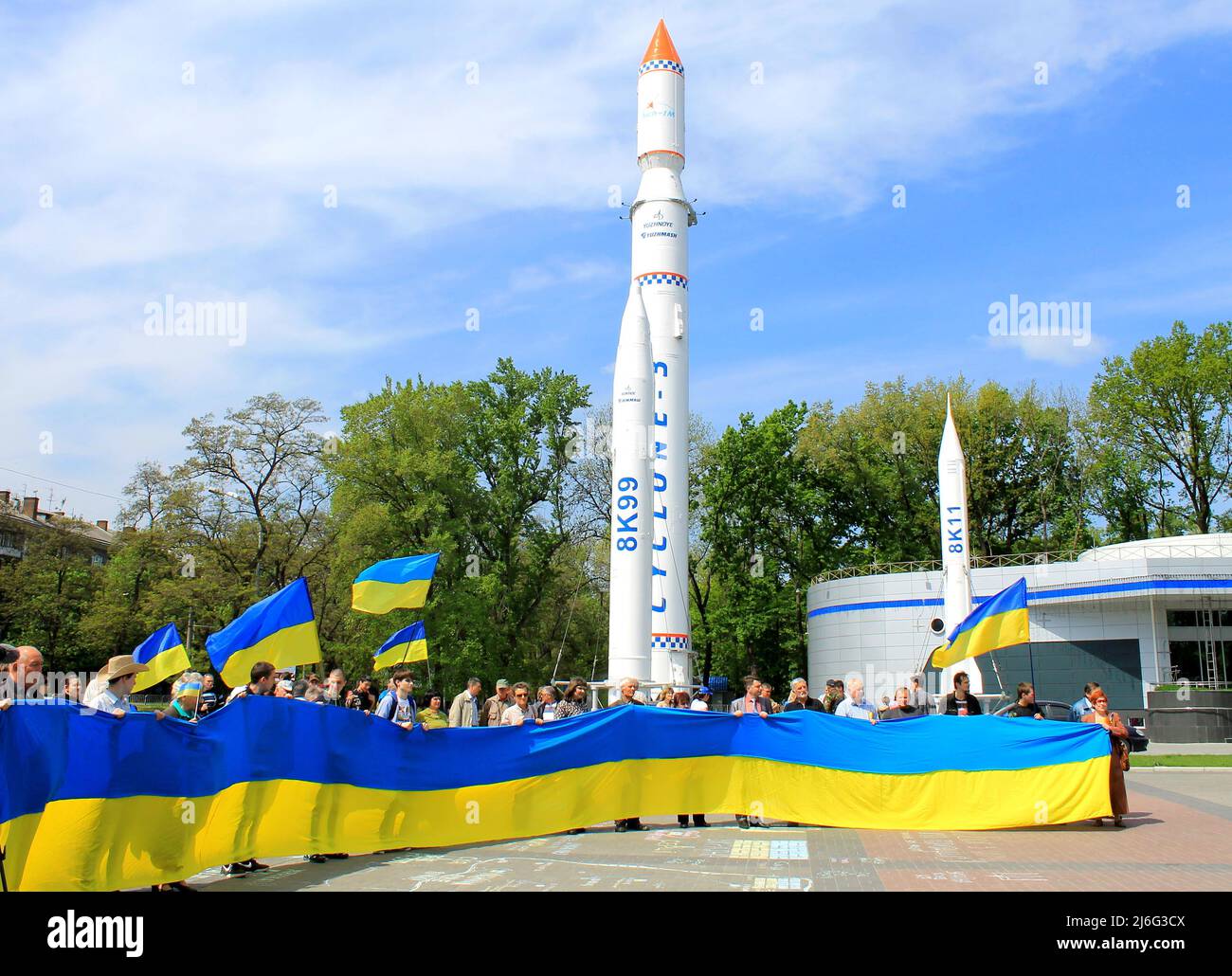 People hold large flags of Ukraine against rockets in city Dnipro ...