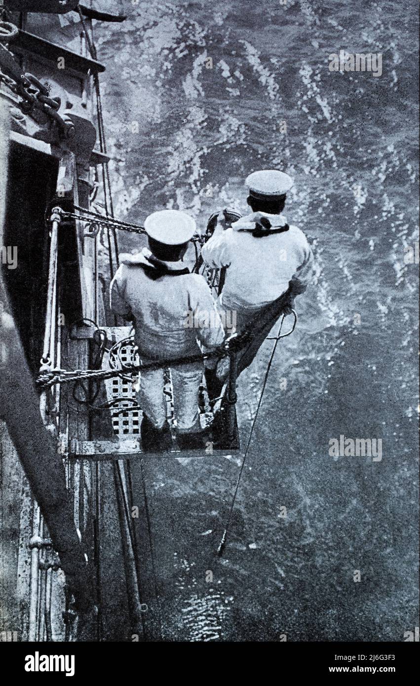 Two British Royal Navy sailors "dropping the lead" at sea, a method of ...