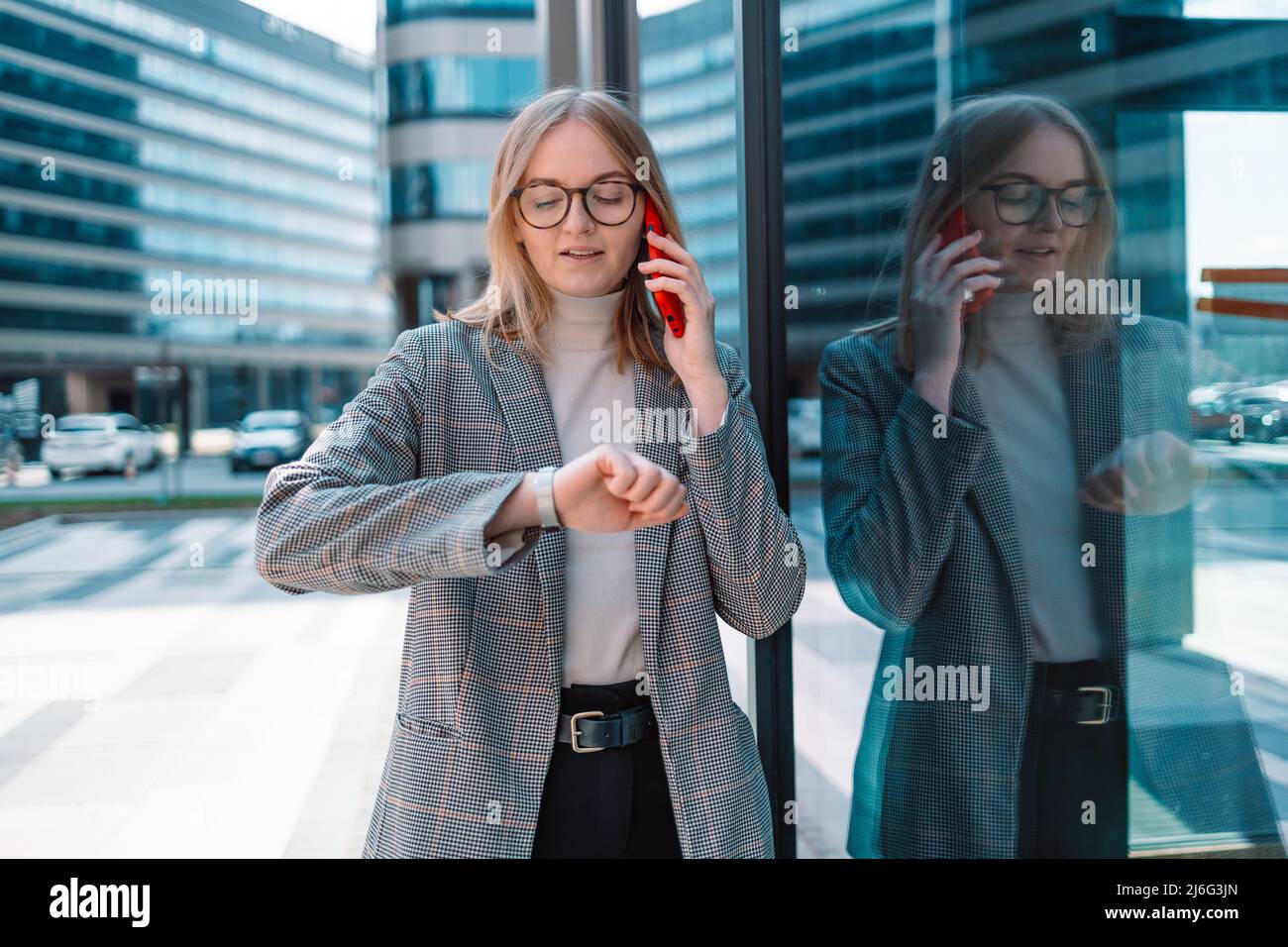 Woman checking clock office hi-res stock photography and images - Alamy