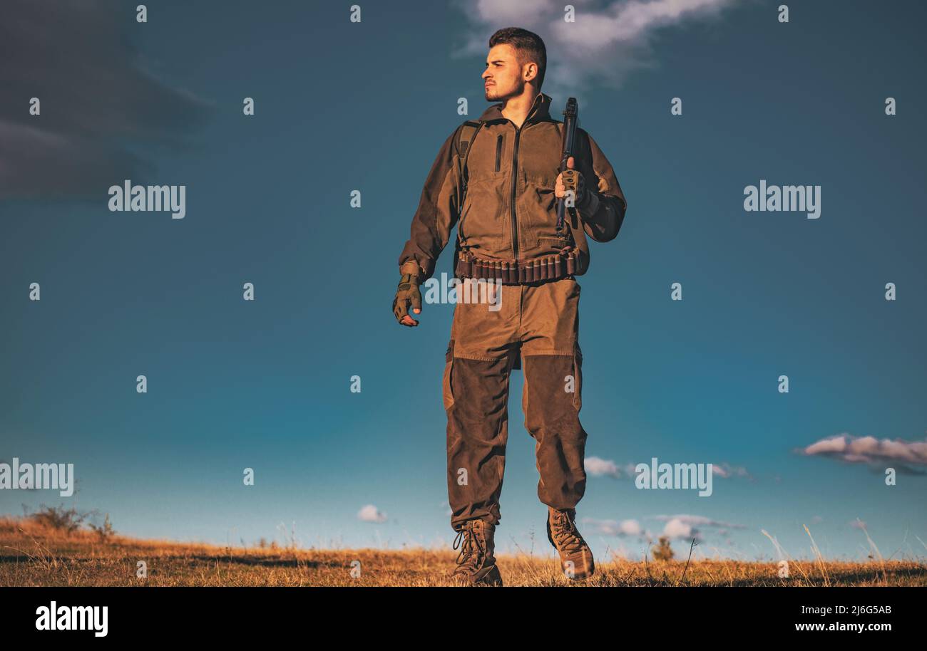 Hunter with shotgun gun on hunt. Hunter in the fall hunting season ...