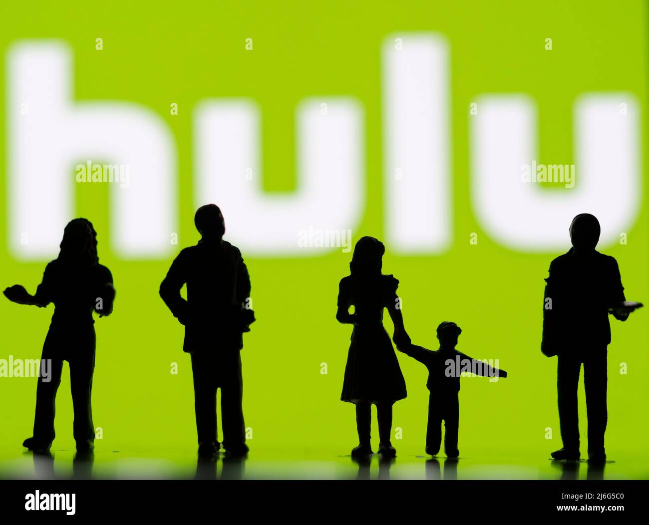 In this photo illustration, miniature figures standing in front of a ...