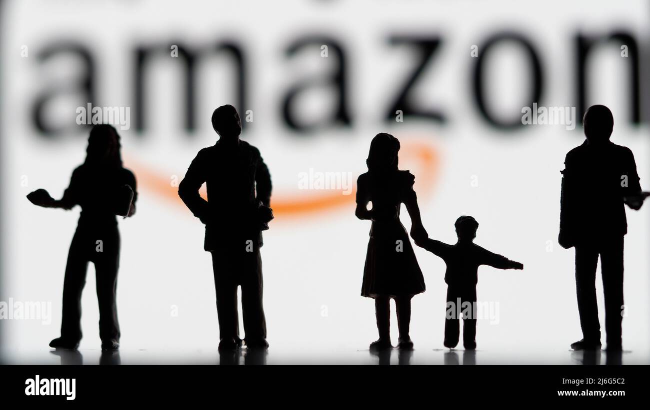 In this photo illustration, miniature figures standing in front of a ...