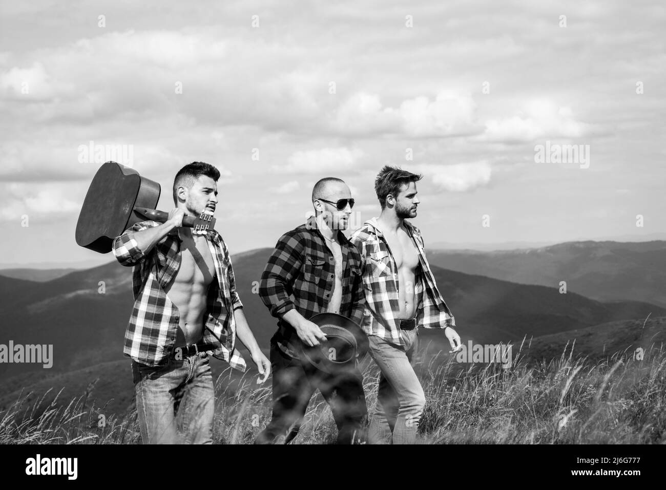 Three Happy Friends Are Looking On Mountains And Having Fun Together three-happy-friends-are-looking-on-mountains-and-having-fun-together