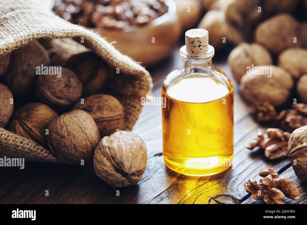 Walnuts. Bottle of essential nut oil, sack of walnuts Stock Photo - Alamy