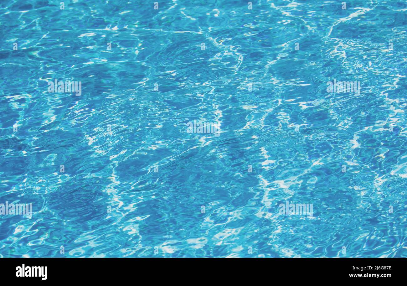 Abstract ripple wave and clear turquoise water surface in swimming pool ...