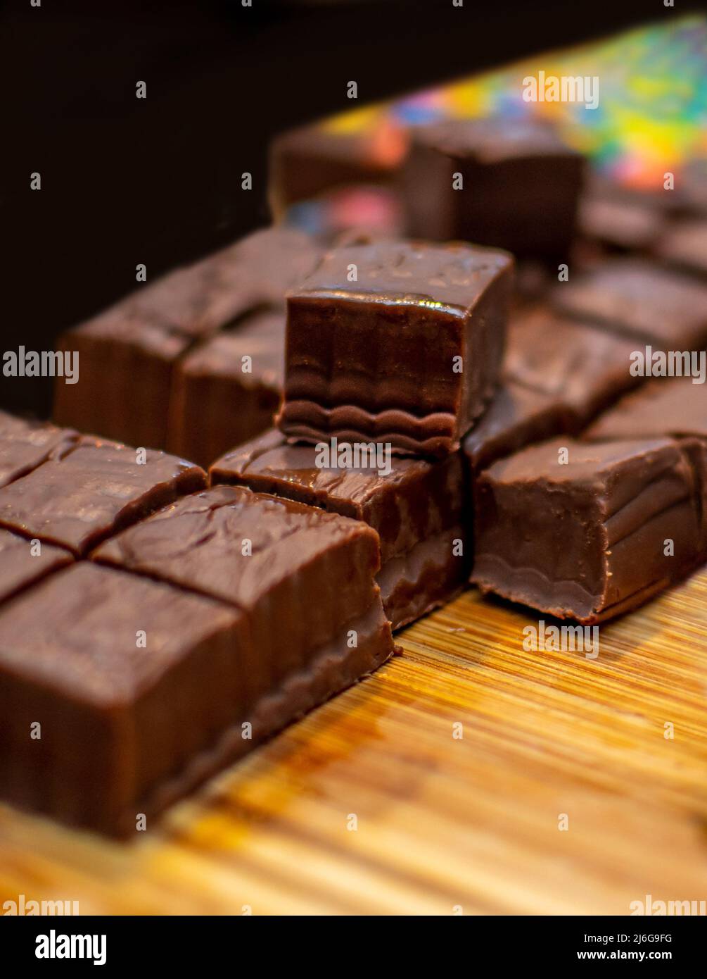 thick chunks of chocolate fudge are cut into delicious pieces to share ...
