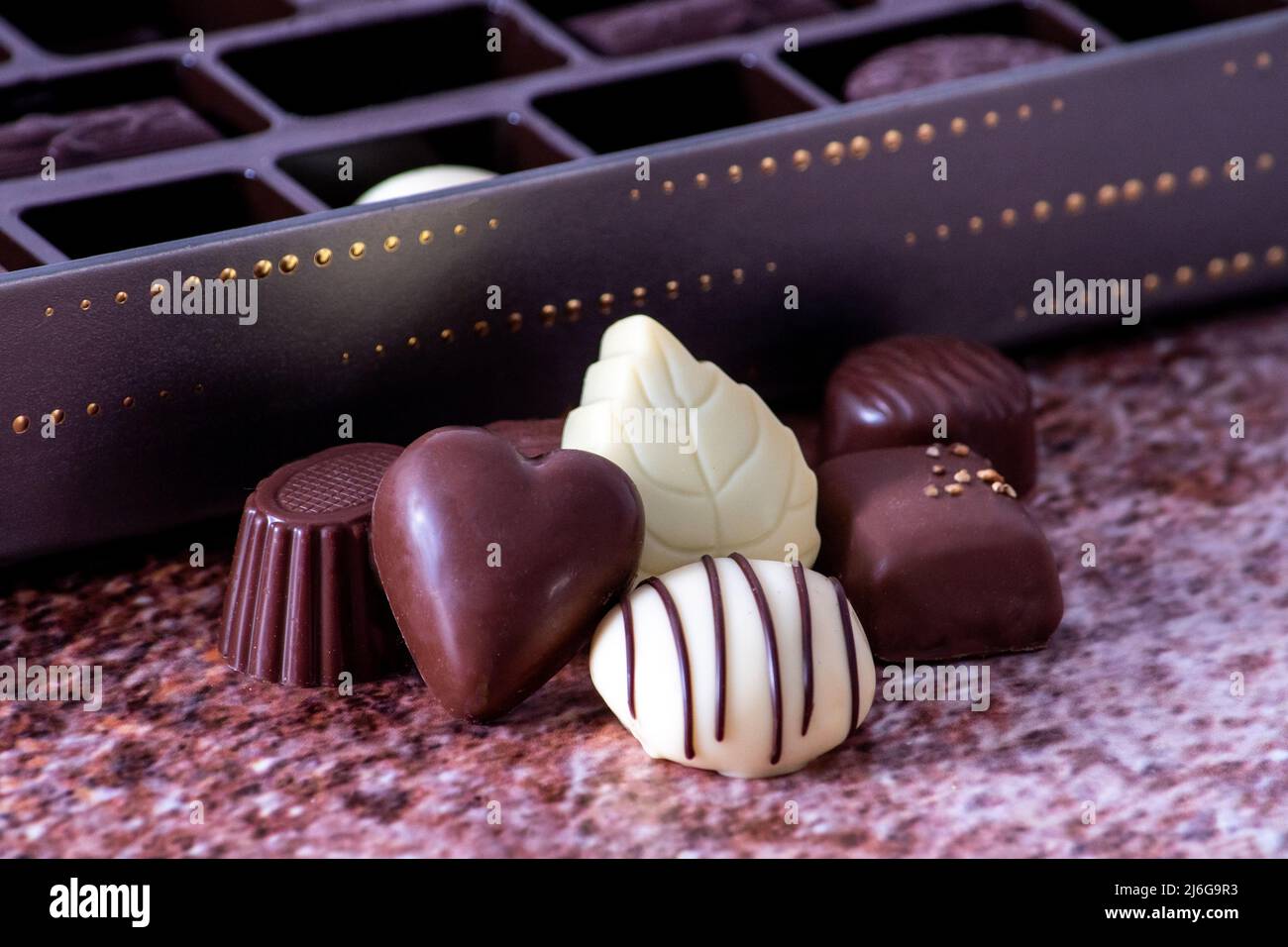 Box of luxury chocolate showcases the sweet treats inside Stock Photo ...