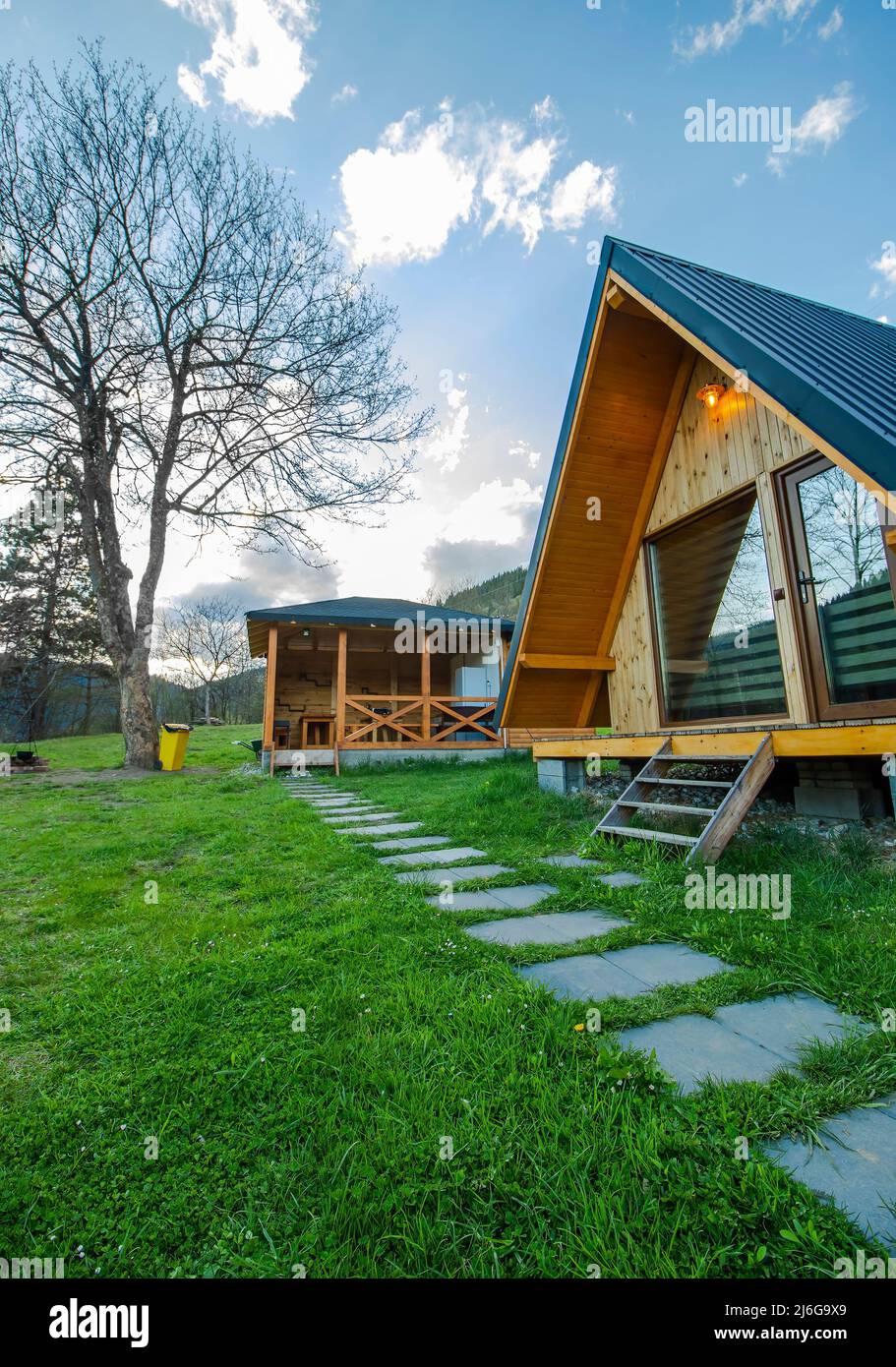 wooden house in nature with fresh green grass Stock Photo - Alamy