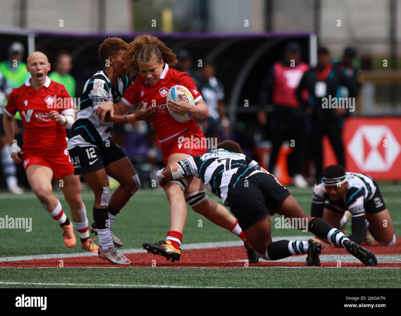 Canada's Renee Gonzalez is surrounded by Fiji players during the second ...