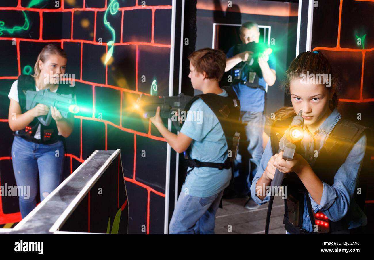 Portrait of teenager girl with laser gun having fun with her fam Stock ...