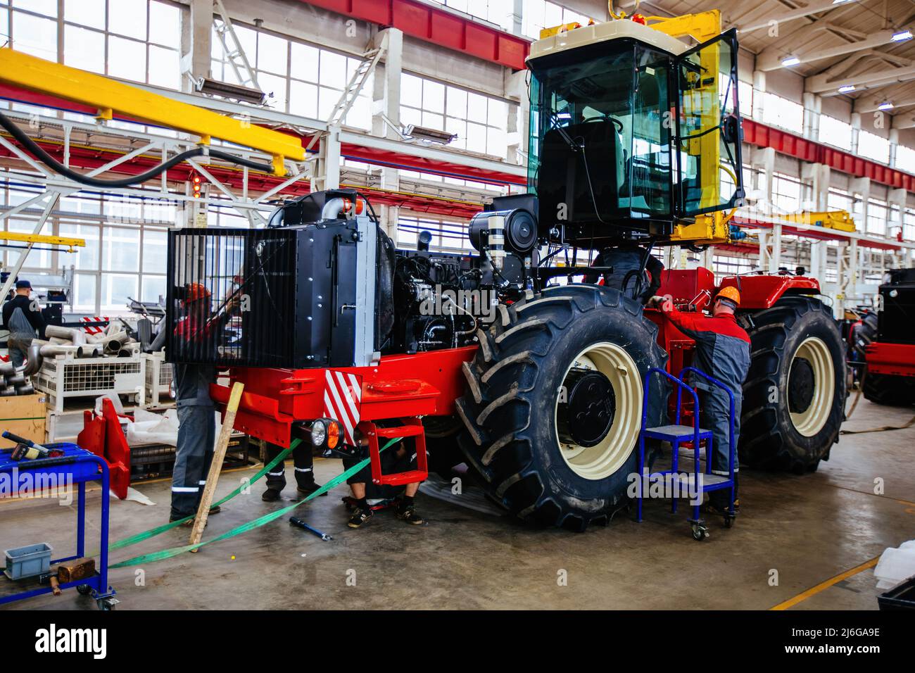 Assembly process of agricultural tractors in industrial workshop Stock ...