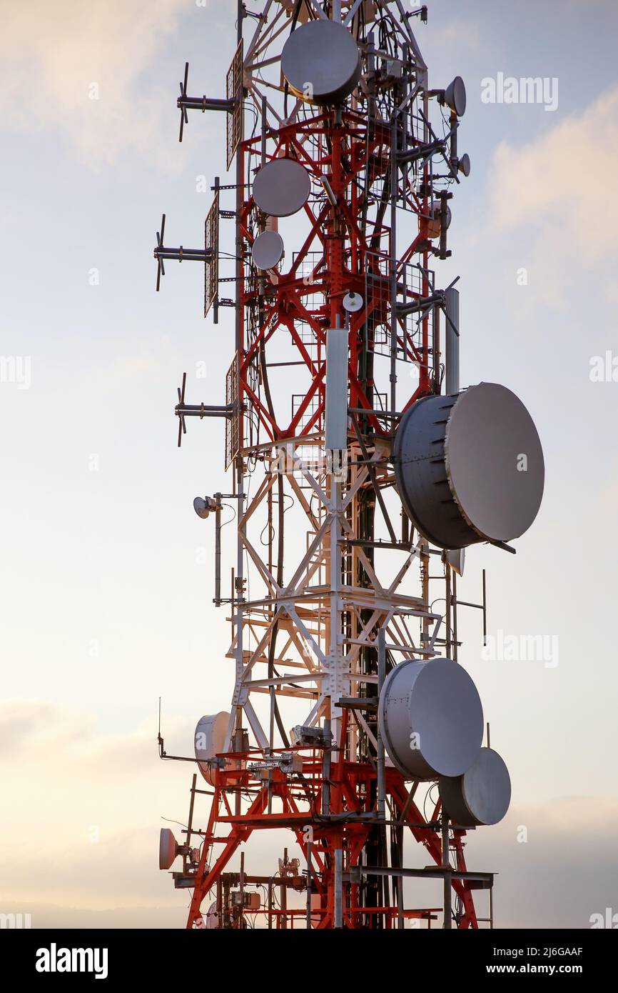 Transmission tower telephone and television tv signals. Red-white ...