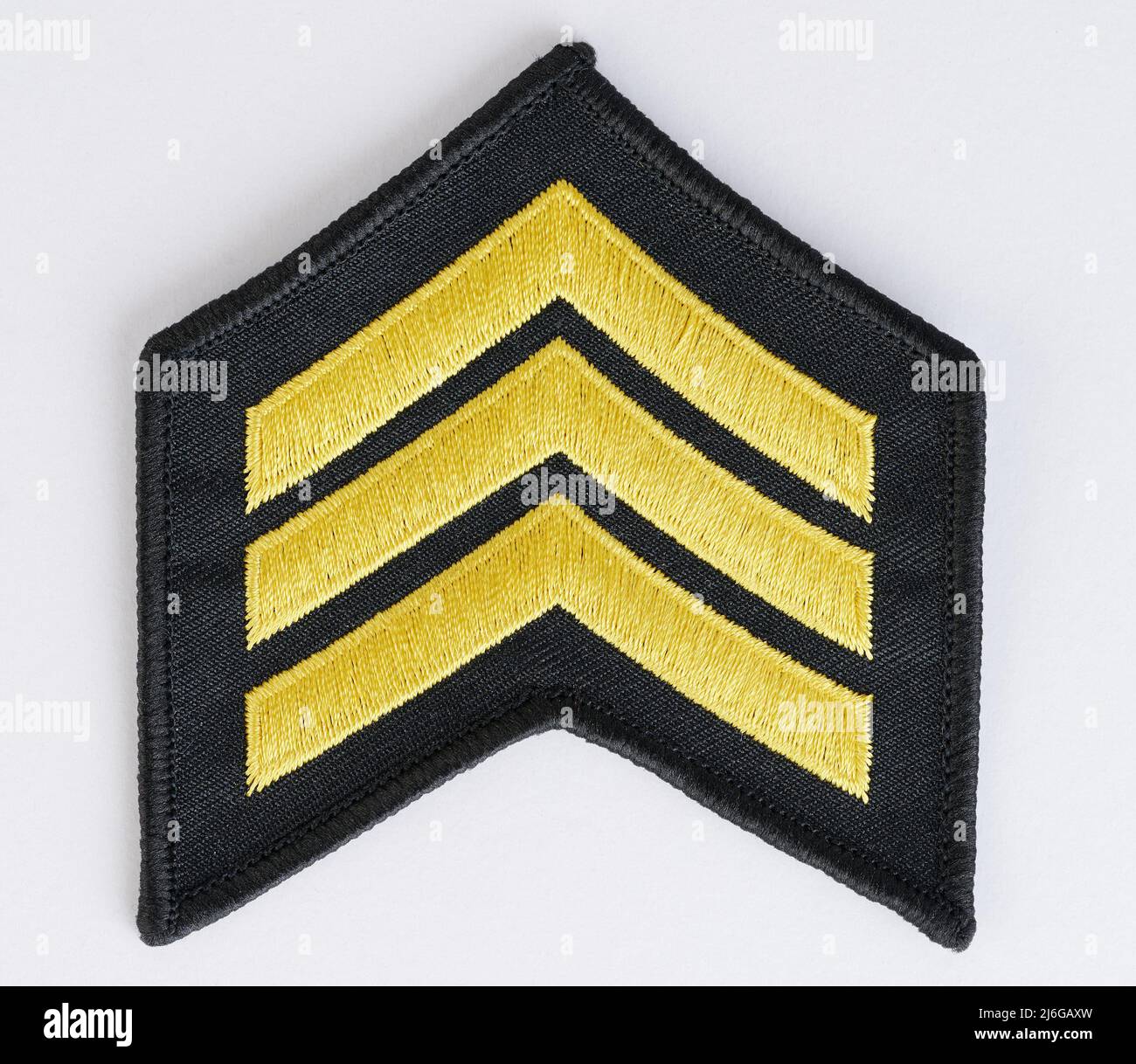 Cloth military chevron of american sergeant isolated on studio ...