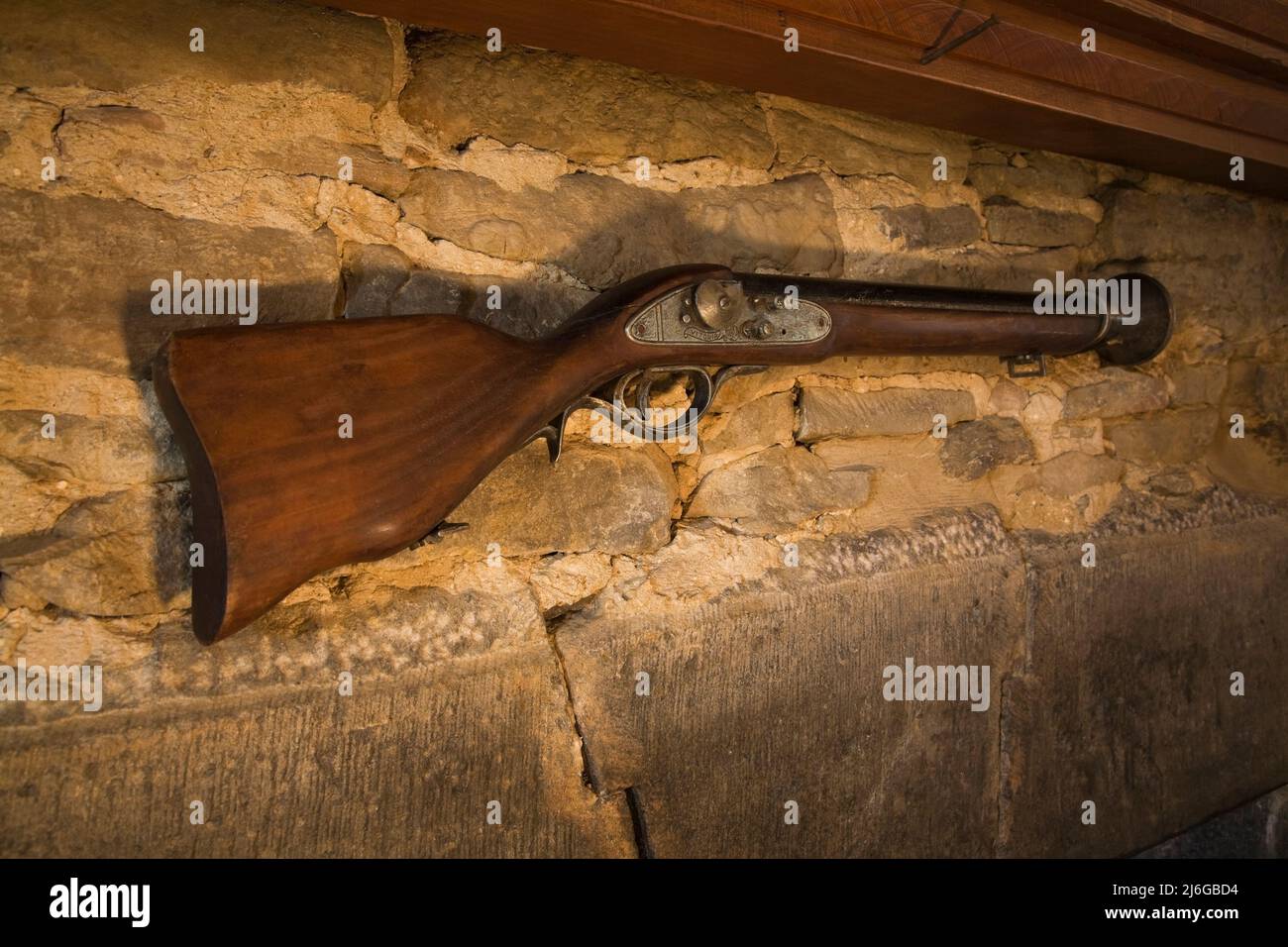 Replica of an old circa 1790 vitoria musket displayed above a stone ...