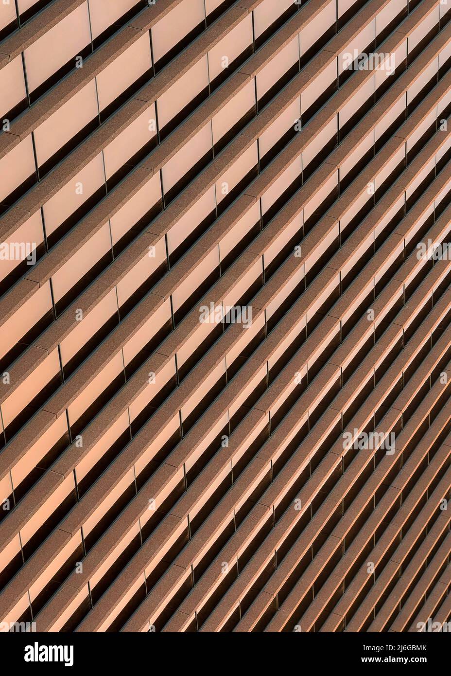 Vertical Building exterior with bronze reflective glass screen at Salt ...