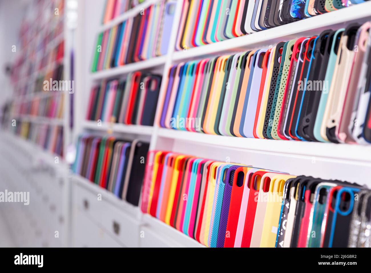 Smartphones on display shelves in an electronics store Stock Photo - Alamy