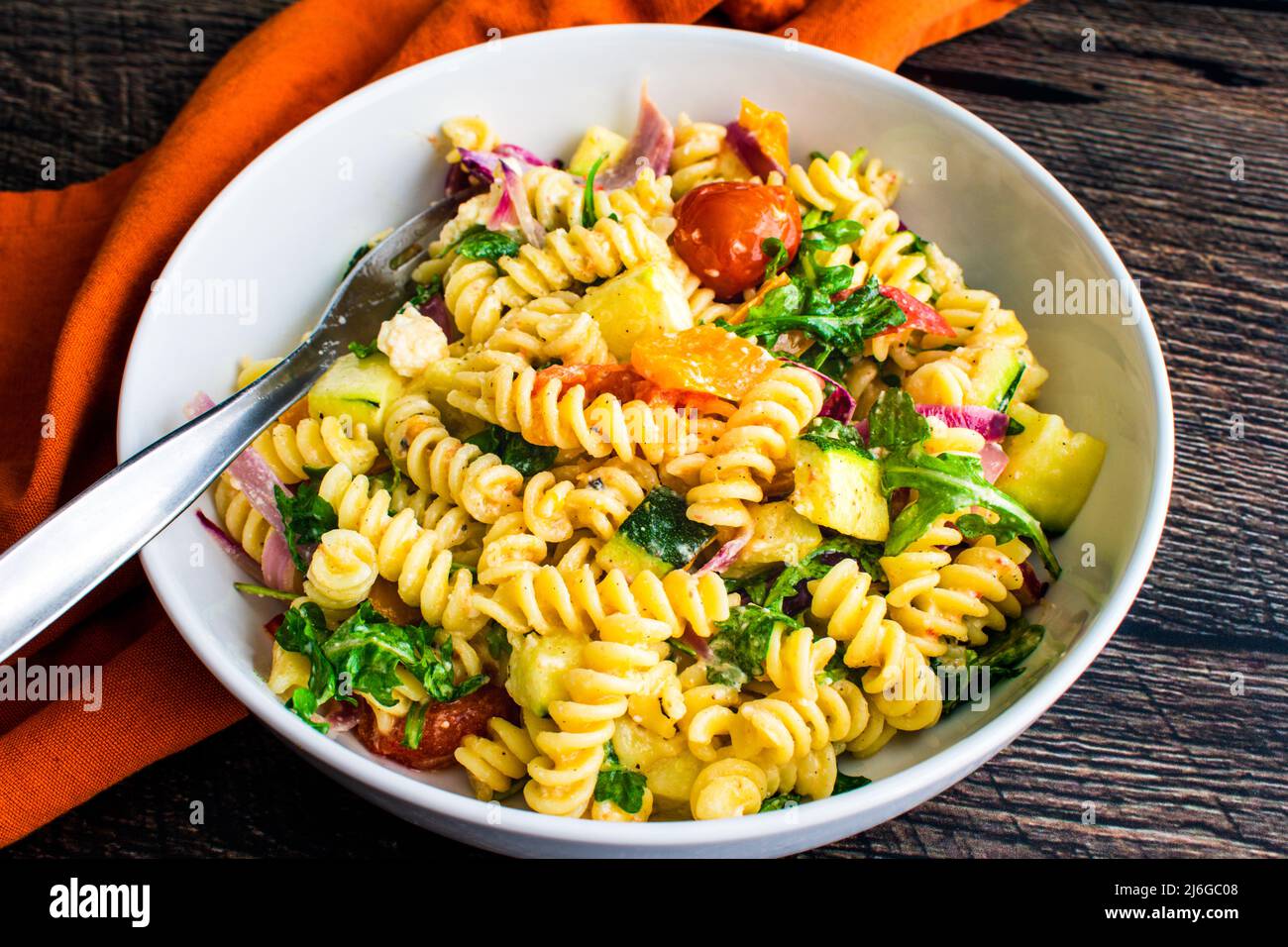 Roasted Veggie Fusilli Pasta with Feta in a Shallow Bowl: Rotini twists ...