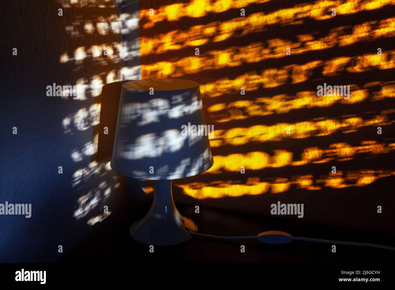 Lampshade in low light . Abstract light reflection in dark room Stock ...