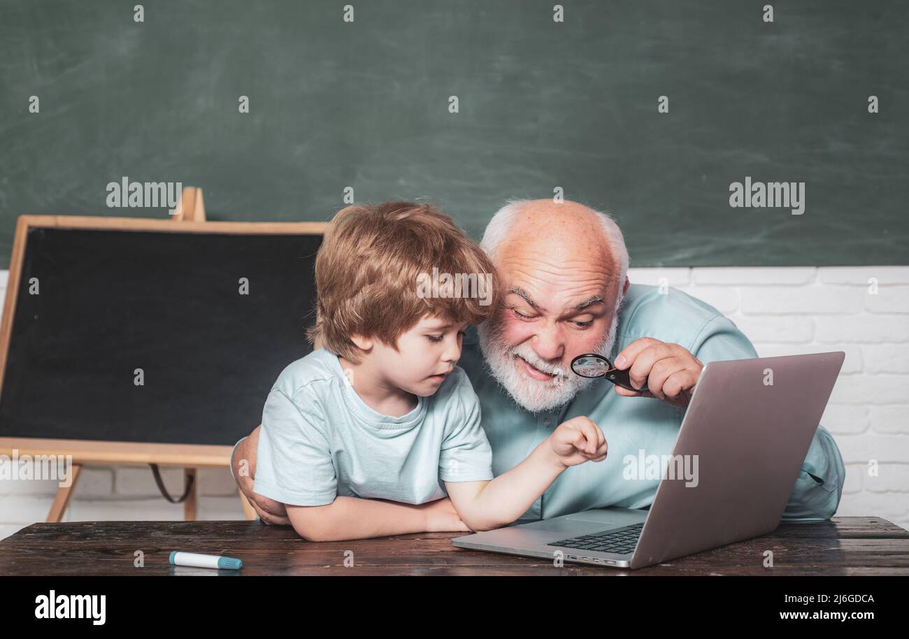 Portrait of confident old male teacher. Grandfather talking to grandson ...