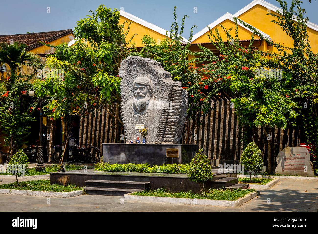 A stone carving of a man with a beard at the courtyard in Old Town ...