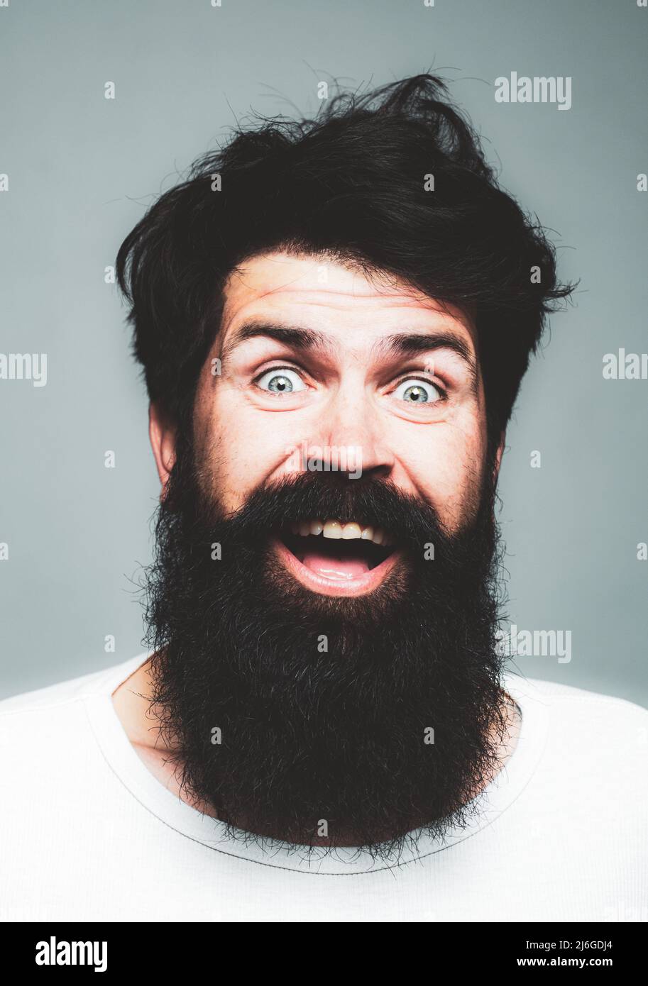 Excitedc Handsome young guy. Portrait of satisfied businessman against ...