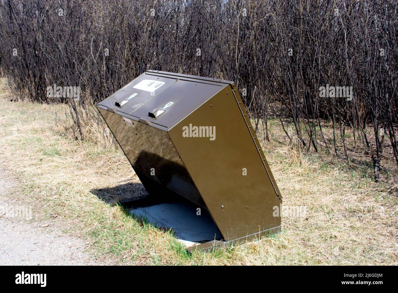 Bear and wildlife proof garbage and recycling disposal box in a parks ...