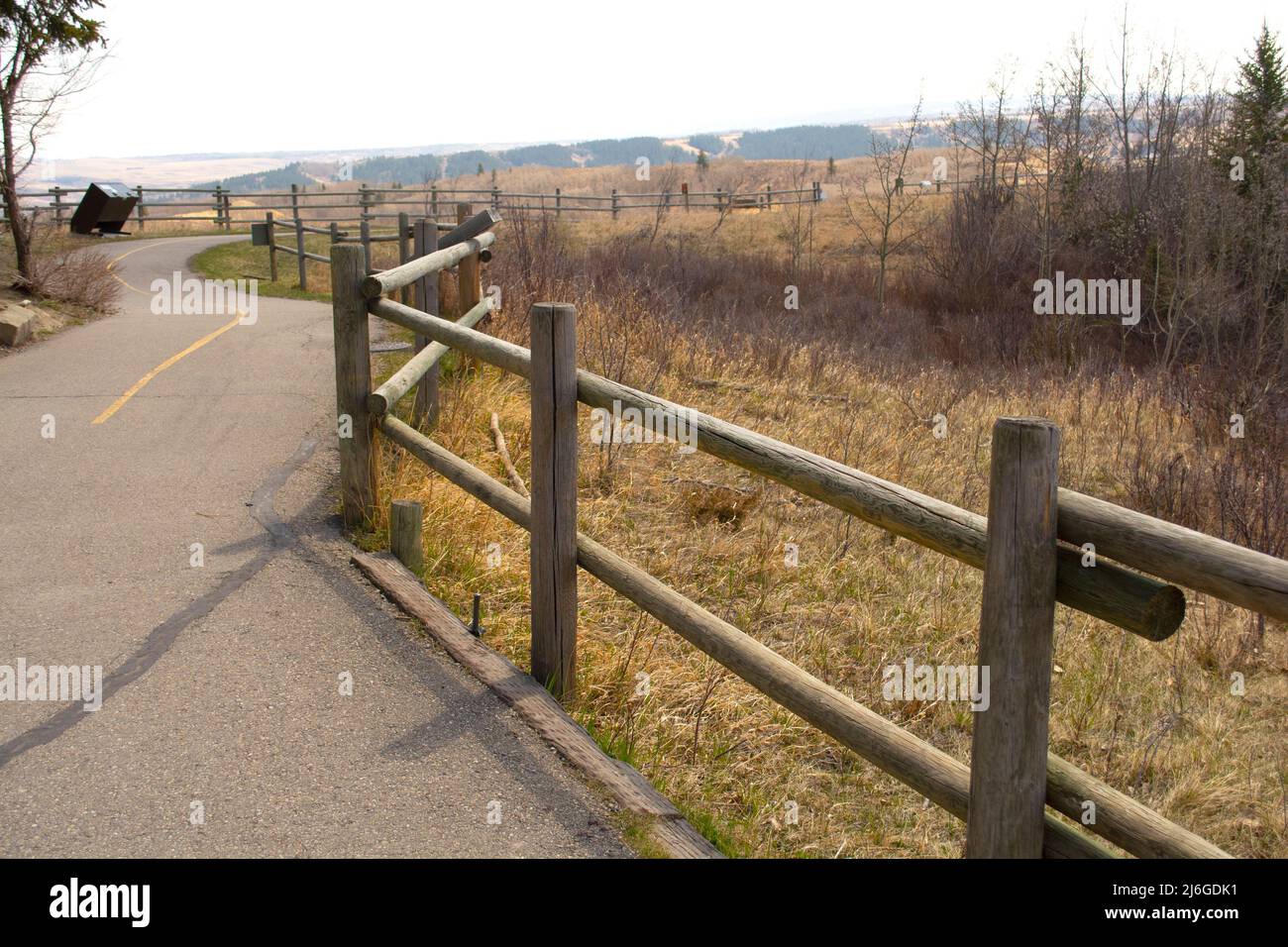 Parks trails wooden fence railing with prairie foothills view Stock ...