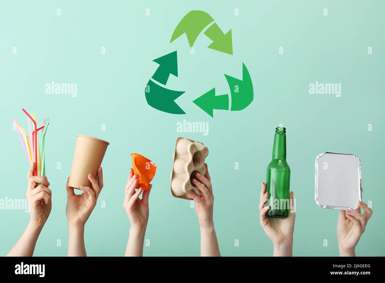 Hands with garbage and symbol of recycling on color background Stock ...