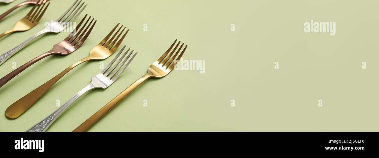 Many different forks on green background with space for text Stock ...