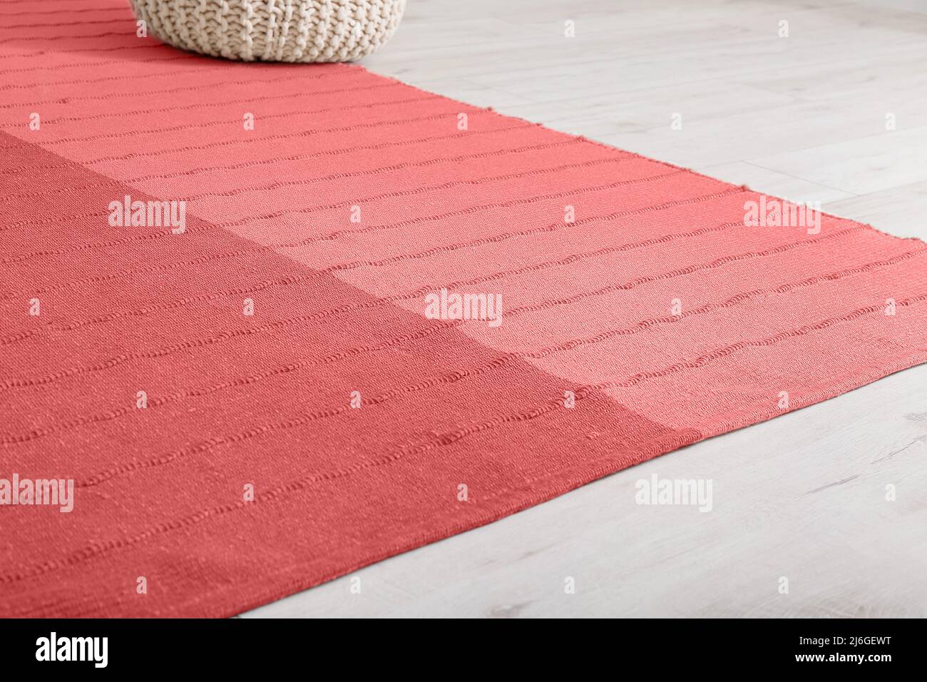 Red carpet on wooden floor in room Stock Photo - Alamy